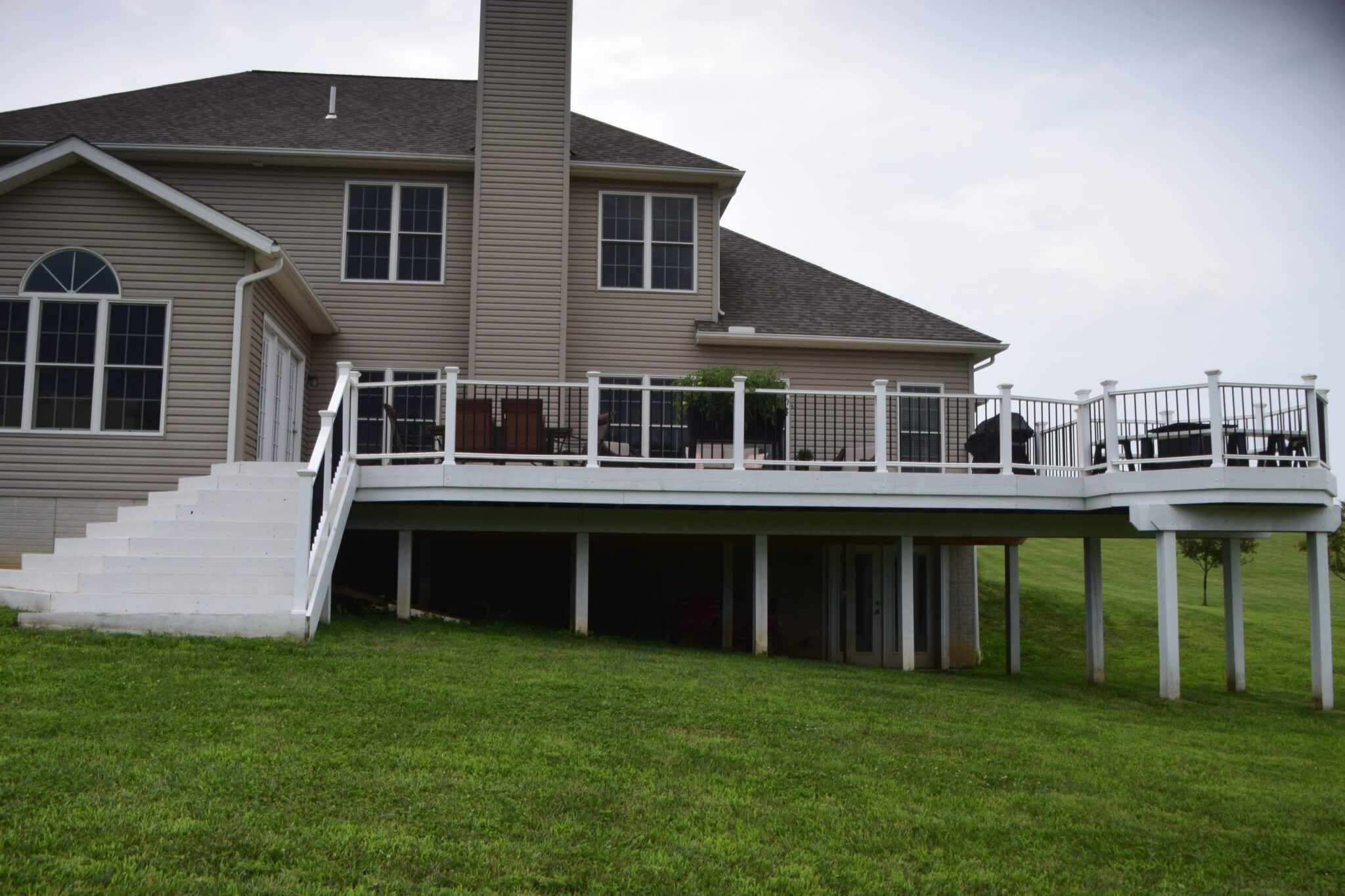 Elevated Concrete Paver Deck with Firepit - StoneDeks